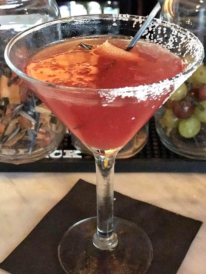 This isn't just a cocktail; it's a sunset in a glass. The salt-rimmed edge adds that perfect contrast, like waves meeting shore.