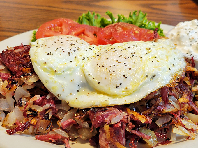 Corned beef hash crowned with sunny-side-up eggs—a breakfast that says, "Today might be tough, but at least it started magnificently."