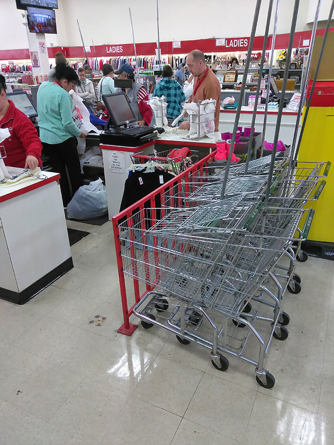 The checkout area: where treasure hunters complete their quests. Those red shopping carts have seen more bargains than Black Friday doorbusters.