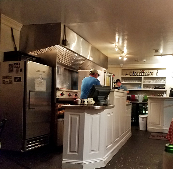 Behind the scenes where beef becomes art. The open kitchen concept was cool long before it was trendy.