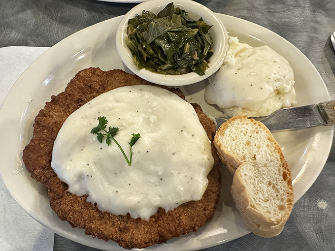 Country fried steak smothered in gravy so good you'll want to write it love letters. Southern comfort on a plate.