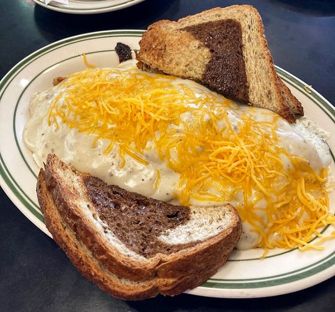 Not all heroes wear capes&mdash;some wear cheese. This country scramble comes blanketed in melted cheddar, turning ordinary toast into supporting characters in this breakfast drama.