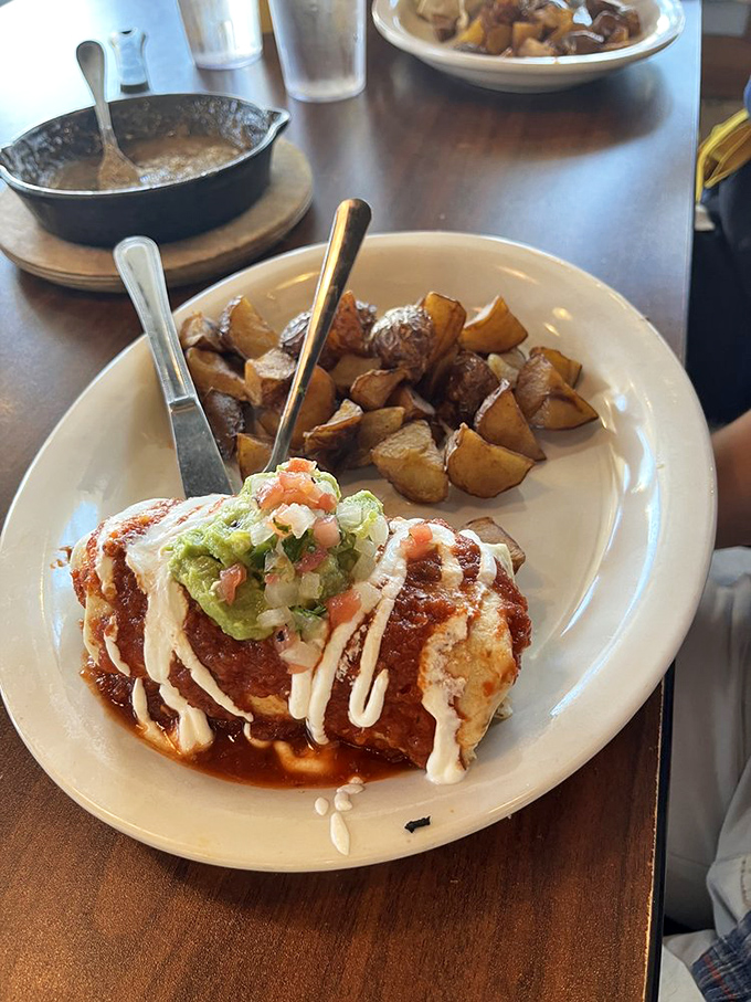 That's not just a burrito&mdash;it's a saucy, cheese-draped flavor bomb topped with fresh guacamole that makes "breakfast" and "lunch" meaningless concepts.