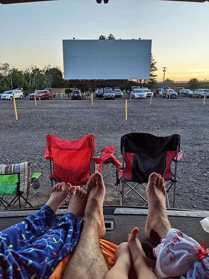 The perfect drive-in viewing position: feet up, blankets ready, and not a stadium seat armrest battle in sight.