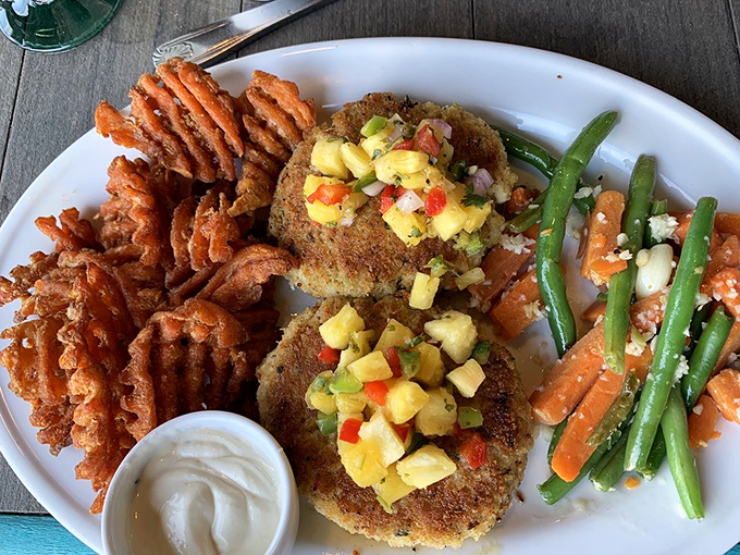 Crab cakes with personality&mdash;golden-crusted treasures topped with tropical salsa that makes your taste buds feel like they're on vacation too.