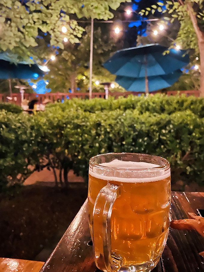 A golden beer in the garden at dusk&mdash;when the string lights twinkle and conversations flow as smoothly as the carefully selected brews.