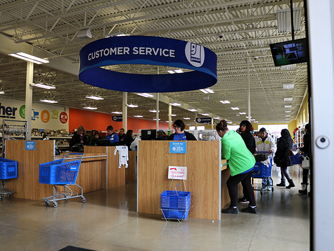 The customer service hub buzzes with activity, where blue carts and friendly staff keep the treasure-hunting experience running smoothly.