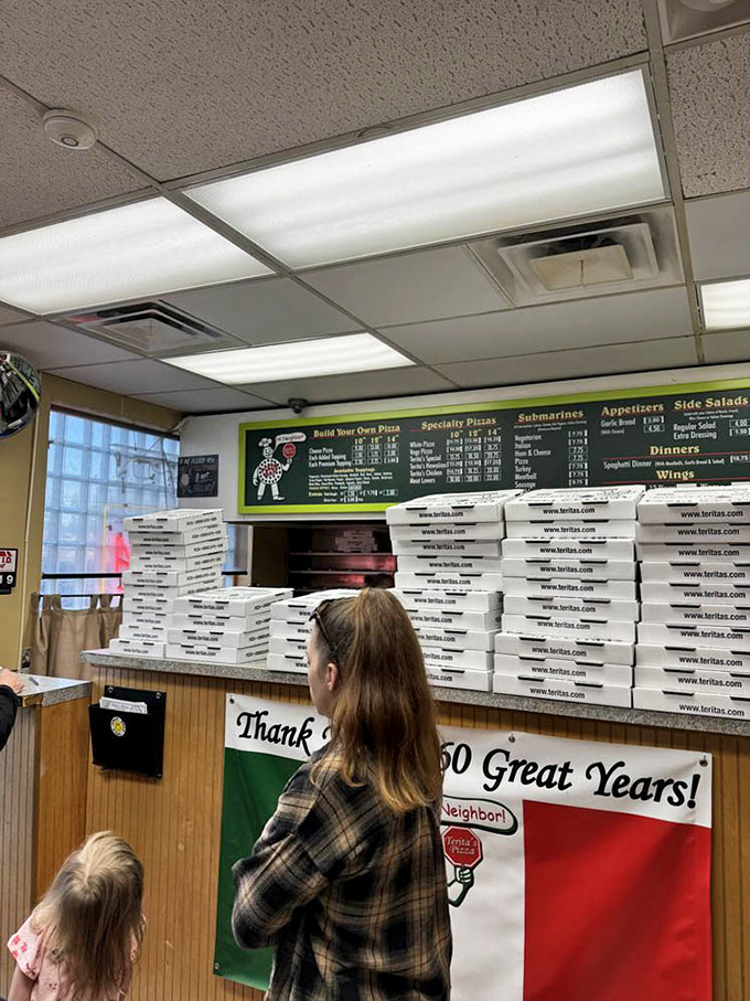 The counter where pizza dreams come true. That stack of boxes represents dozens of Columbus families about to have their best night of the week.