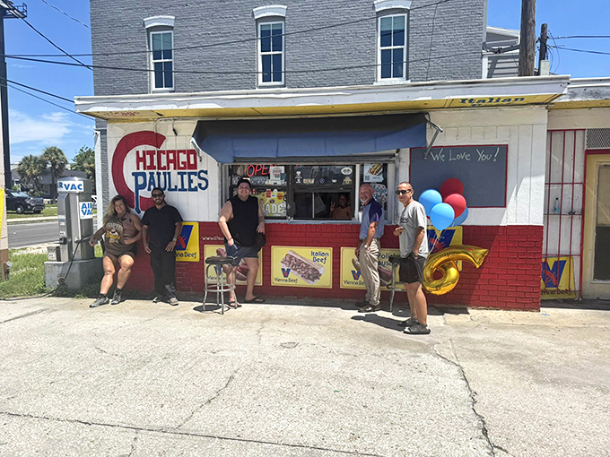 The true measure of any food spot: happy customers gathering outside, drawn together by the universal language of exceptional street food.