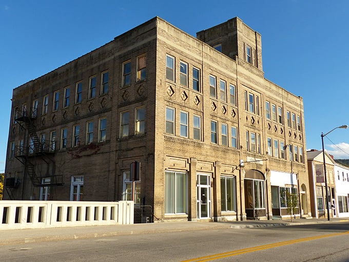The Dalton Theatre Building stands as a testament to early 20th-century optimism, its grand windows overlooking a Main Street that's seen both boom and bust.