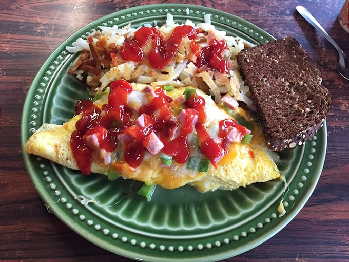 An omelet that's more stuffed than your holiday turkey, topped with salsa that adds both color and kick. The dark bread alongside whispers "health" just loudly enough.