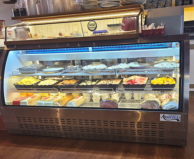 The display case: where dreams are stored at precisely the right temperature. Each tray contains something that will make tomorrow's diet start date move one day further.