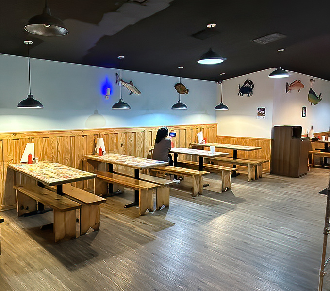 Simple bench seating with fish silhouettes swimming across the walls &ndash; casual dining where the focus stays firmly on what's on your plate.