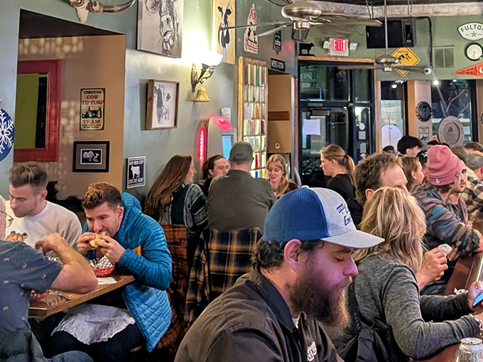 The universal language of good food brings strangers together. Notice how nobody's looking at their phones? That's the Tipsy Cow magic.