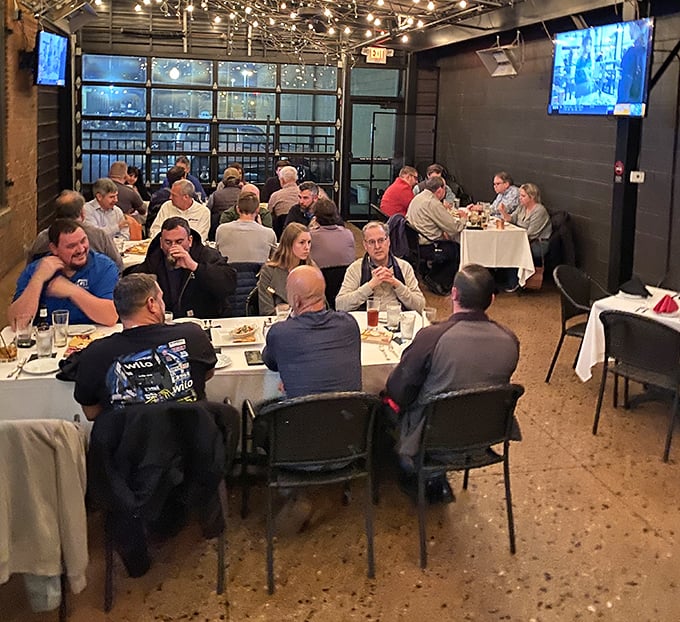 The private dining area buzzes with conversation and clinking glasses &ndash; proof that breaking bread together remains humanity's finest social invention.