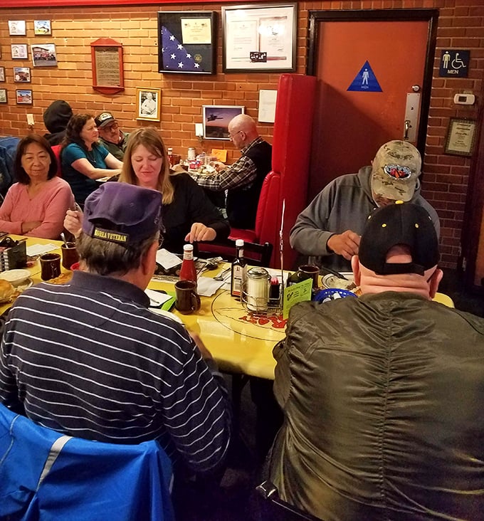 Where strangers become neighbors over bottomless coffee and shared condiments. The yellow tablecloths have witnessed more life stories than a bestselling memoir.