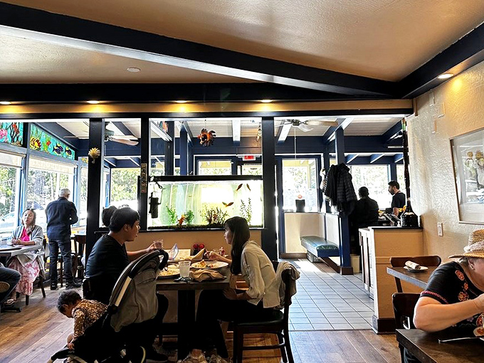 The dining room buzzes with the energy of people having genuinely good meals. Notice how nobody's looking at their phones? That's the power of great food.