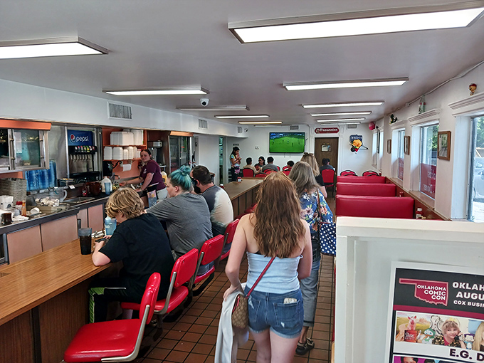 The lunch counter ballet&mdash;hungry patrons and efficient staff performing the timeless dance of American diner culture that never goes out of style.