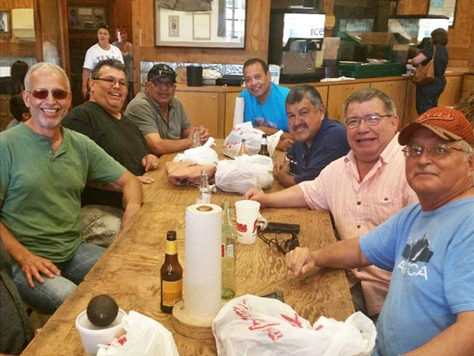 Strangers become friends over trays of smoked meat, united by the universal language of "mmm" and "pass the napkins."