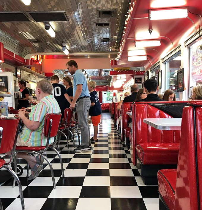 The symphony of a busy diner in full swing&mdash;clattering plates, murmured conversations, and the occasional laugh punctuating it all.