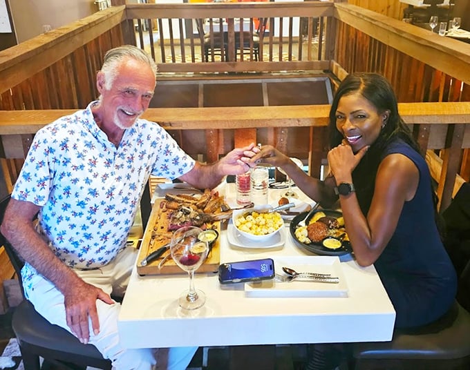 Two diners sharing that universal "this is incredible" look that transcends language&mdash;the international sign for "order what they're having."