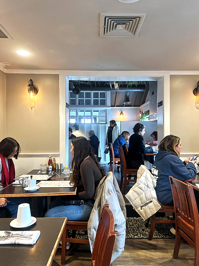 A bustling dining room where breakfast dreams come true. Notice how nobody's looking at their phones? That's the power of exceptional food.