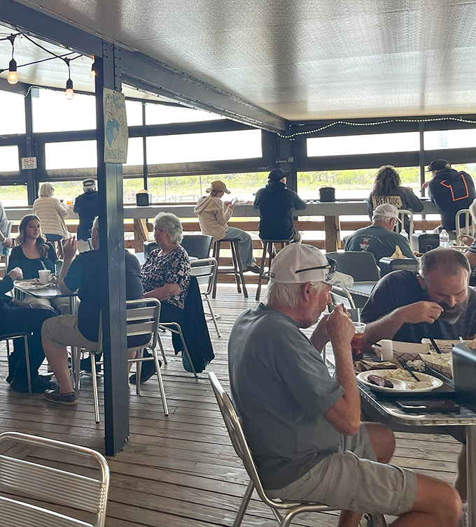 The covered patio offers waterfront dining where the only thing more satisfying than the view is what's on your plate.