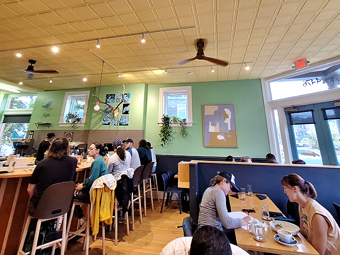 A bustling dining room where strangers become friends over the shared religion of exceptional breakfast. The energy is as nourishing as the food.