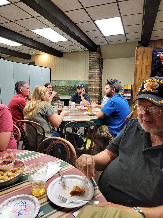 Generations of families gather around these tables, creating memories one slice at a time &ndash; the true magic of a neighborhood institution.