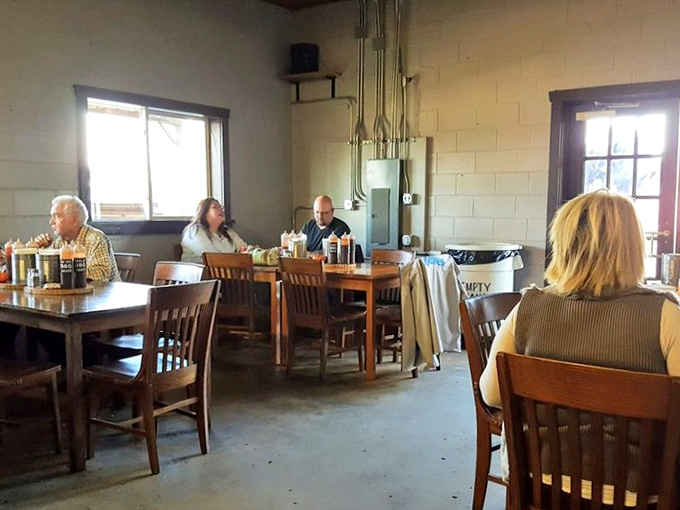 A gathering of the barbecue faithful. These diners know that great food brings people together better than any fancy tablecloth ever could.