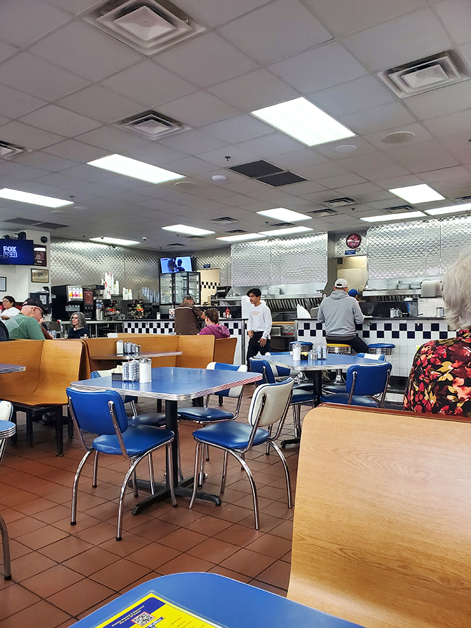Morning light streams across the diner floor where regulars and newcomers alike find common ground in the universal language of breakfast.