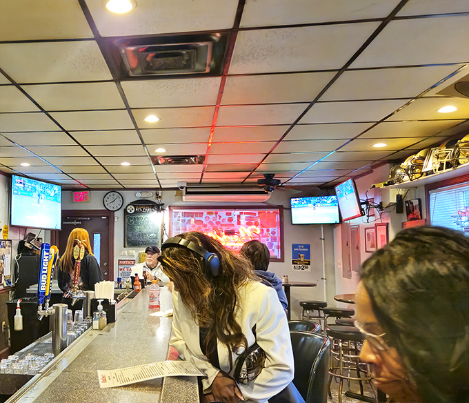 The bar area doubles as breakfast central during morning hours, where sports on TV complement conversations about last night's game.