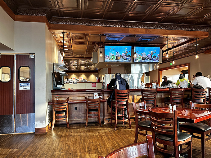 The counter seating offers front-row views of culinary magic. Where solo diners become part of the 49er's extended family.