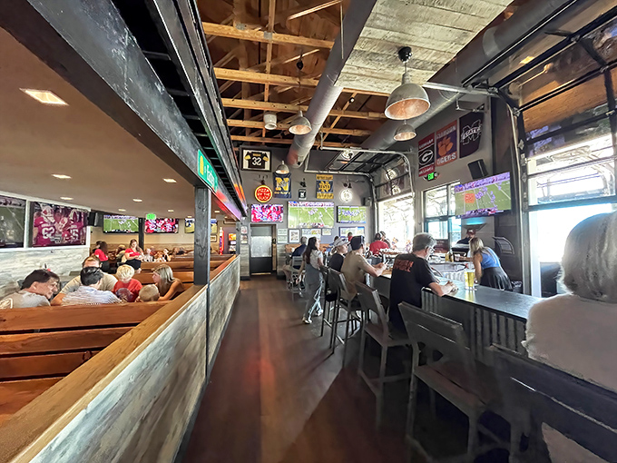 The bar area buzzes with energy as locals and visitors mingle. Those wooden booths are perfect for settling in when "just one drink" turns into dinner.