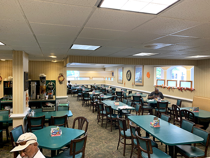 The dining area stretches out like a community gathering space, where conversations flow as freely as the sweet tea.