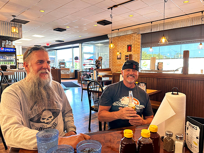 The true measure of any barbecue joint: happy customers sharing stories over bottles of sauce and anticipation of what's coming from the kitchen.