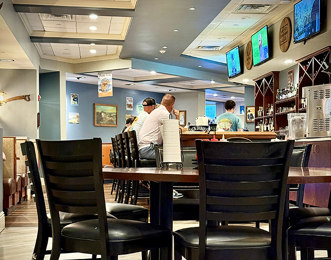 Where the magic happens—the bar area combines sports, spirits, and sociability. Notice how everyone's leaning in, as if the secret to happiness is behind that counter.
