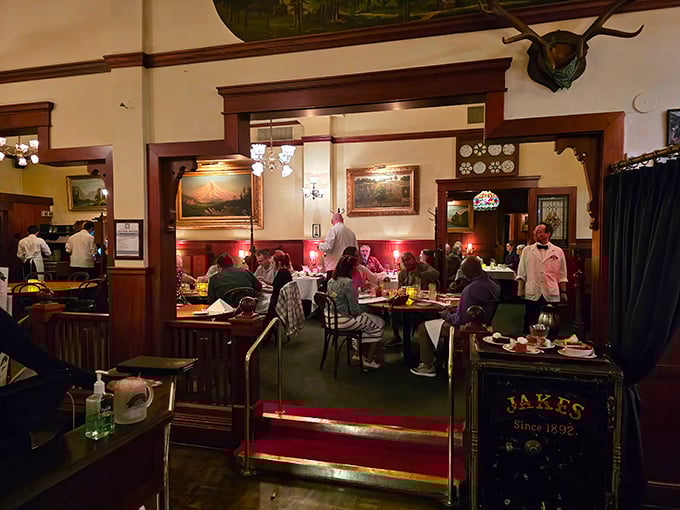 Jake's dining room feels like stepping into a painting where everyone's about to have the best meal of their week.