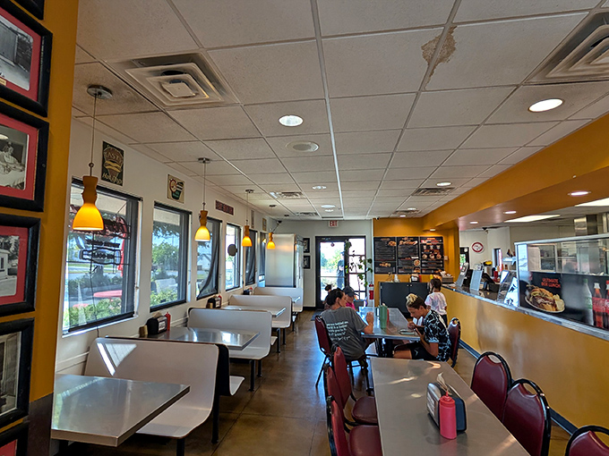 The dining area balances nostalgia with comfort, where conversations flow as freely as the fry sauce.
