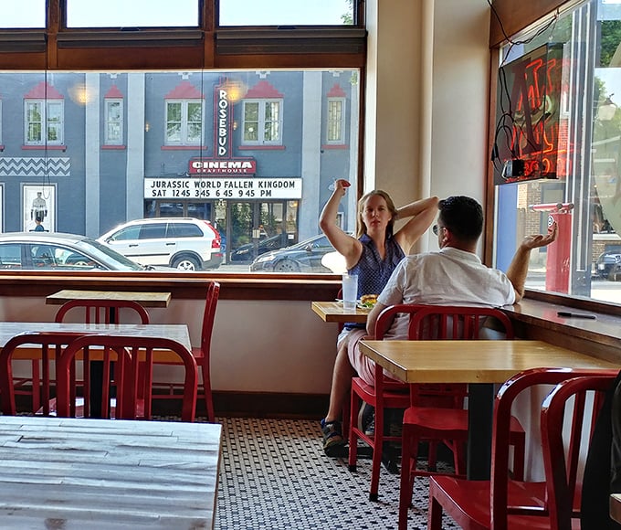 Through these windows, diners witness both street scenes and their own transformation into people who now understand what bread should taste like.
