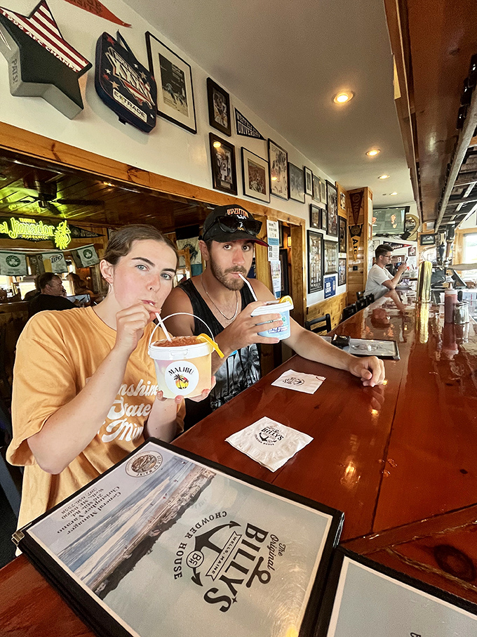 Patrons enjoying Billy's famous chowder at the bar. Those expressions say everything about the first experience!