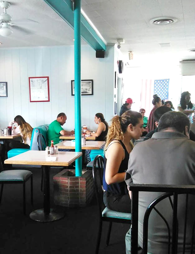 Weekend warriors patiently waiting for their breakfast fix—the universal language of "worth the wait" spoken through packed tables and happy diners.