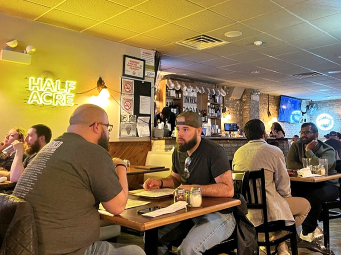 Where pizza pilgrims gather beneath exposed brick and warm lighting, patiently awaiting their moment of caramelized crust enlightenment.
