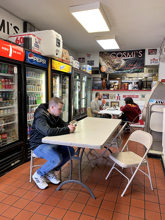 The lunchtime ritual: customers patiently waiting for their turn at greatness while checking phones for the day's Eagles news.
