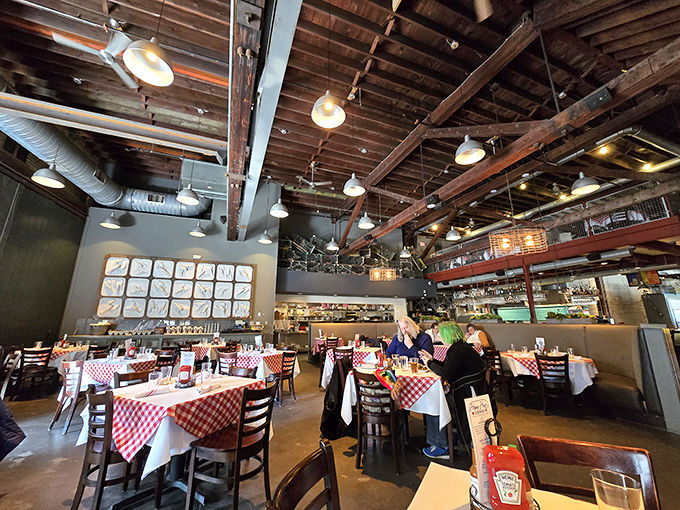 Soaring ceilings and wooden beams frame this dining room where seafood dreams come true and diet plans go to die happily.