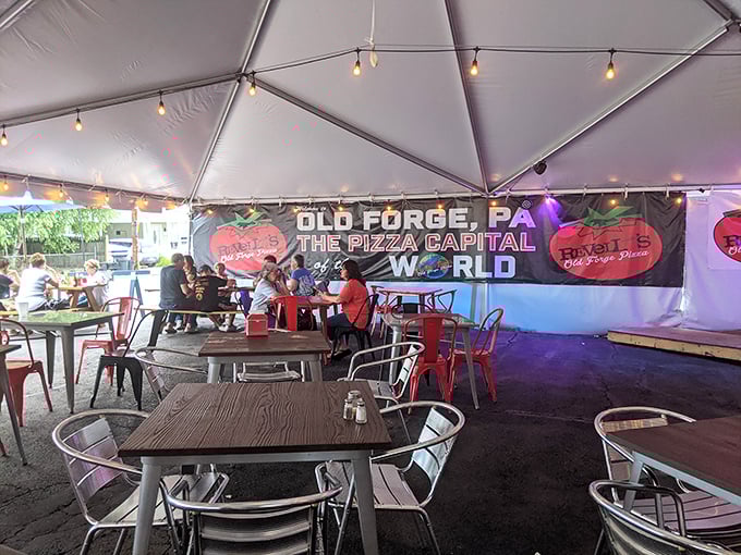 Old Forge proudly claims its Pizza Capital status right there on the tent for all to see.