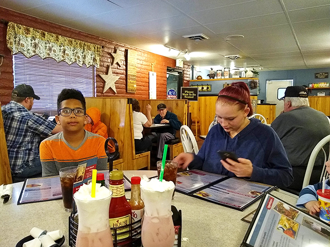Where diner magic happens&mdash;patrons enjoying milkshakes and conversation in booths that have likely witnessed thousands of "remember when" stories.