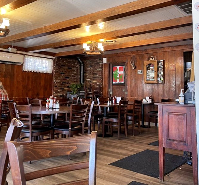 Wood-paneled walls and cozy lighting create that timeless diner atmosphere where comfort food feels even more comforting than usual.