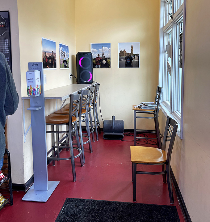 Simple seating with travel photos that remind you: great food is the ultimate destination. No passport required for this journey.