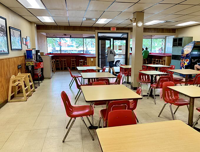 Red chairs await hungry patrons like old friends. No designer needed to create this vibe &ndash; just decades of satisfied customers and countless memorable meals.